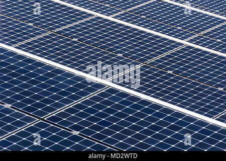 Blue rotating solar panels tilted axis tracker, future energy concept ...