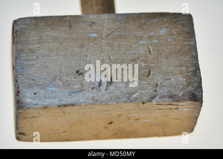 A hammer from a tree lies on an isolated background. The hammer was ...
