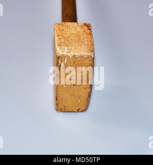 A hammer from a tree lies on an isolated background. The hammer was ...