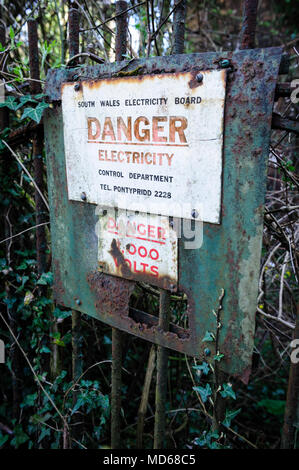 Rusting warning sign, South Wales Stock Photo - Alamy