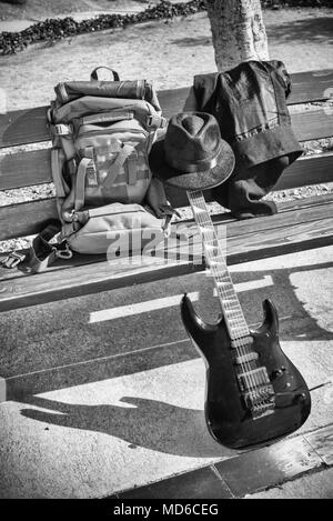 Free tramp lifestyle objects on a park bench Stock Photo - Alamy