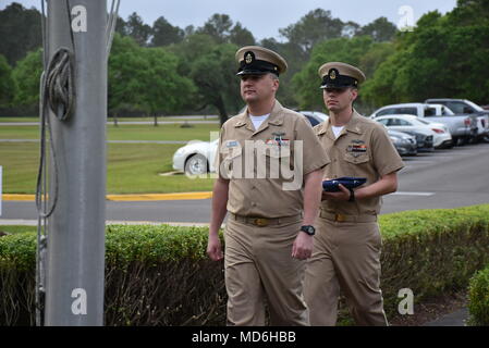 AGC Jason Archibald (left) and AGC Chad Collier (right) carry the flag ...