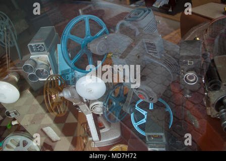 Shop-window, old, retro, aged photo, movie cameras close up ...