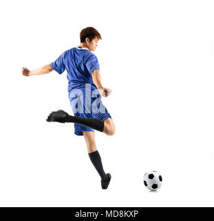 Asian football player man in a blue jersey kicking the ball on the ...