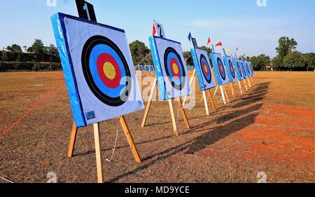 Outdoor archery targets on grass field surrounded by forest in the ...