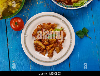 Indian cuisine . koonthal - Squid Kerala Roast ,Traditional assorted ...