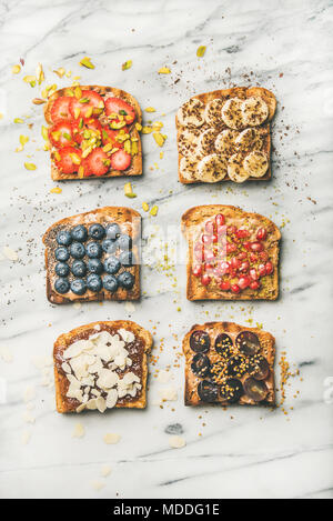 Wooden spoon with tasty nut butter on white background, closeup Stock ...