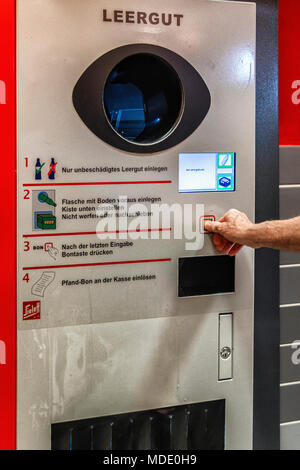 Berlin, Germany. Elderly senior man returning empty bottles to ...