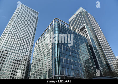 Abstract reflections of buildings in the curved green glass façade of ...