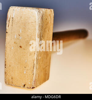 A hammer from a tree lies on an isolated background. The hammer was ...