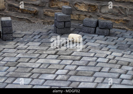 Concrete products; Construction industry; Paved ground. Interlocking paving with gray and white ...