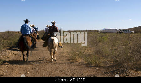 Cowboys on their way to a cattle round up in West Texas ranch Stock ...