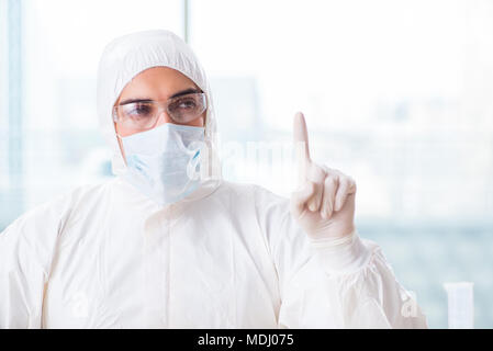 Young chemist pressing virtual buttons in lab Stock Photo - Alamy