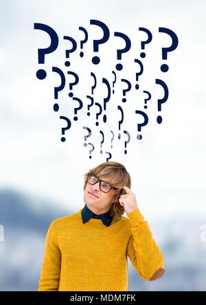 Young man thinking with question mark circulation around his head Stock ...