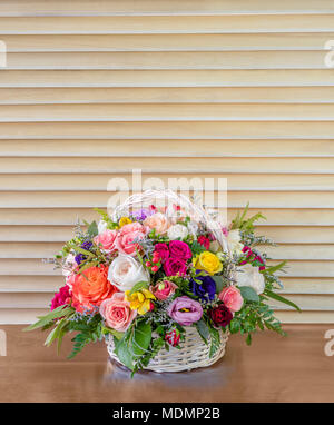 Bouquet of red roses in wicker basket. Party decor Stock Photo - Alamy