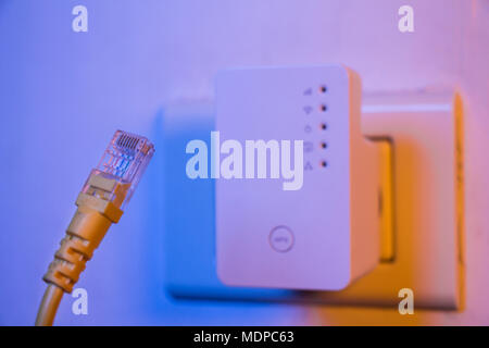 Ethernet cable connected to socket in wall. Internet connection Stock ...