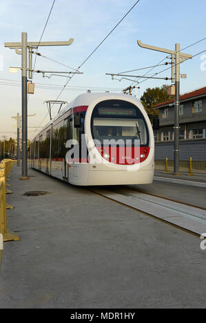 A tram approaches Xiangshan station on the Xijiao line in Beijing ...