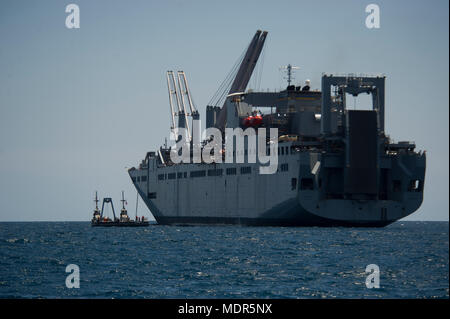 A U.S. Navy Improved Navy Lighterage System Causeway Ferry, prepares to ...