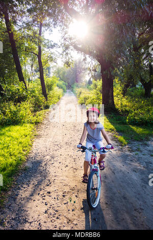 girl on bike at sunset Stock Photo - Alamy