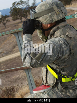 A U.S. Army gun crew uses a M777 A2 howitzer to fire illumination ...