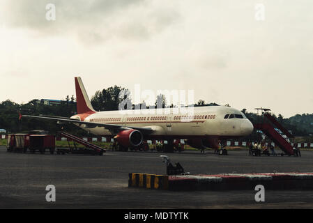 Commercial passenger airplane during push back operation. Shiny metal ...