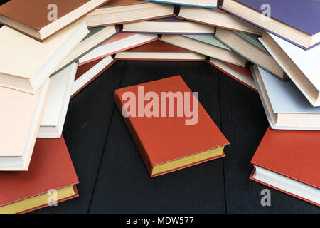 Book stacking open book hardback books on wooden table. copy space ...