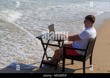 Business Man Working on Tropical Beach Stock Photo - Alamy