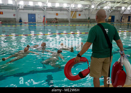 Marine recruits are taught water survival during basic training at the ...