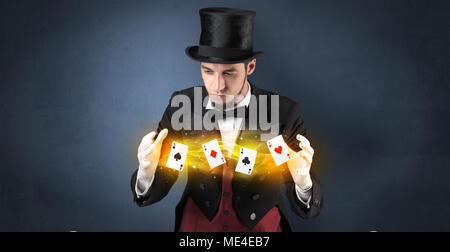 Illusionist in tails bandy play cards between his two hands Stock Photo ...