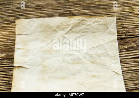 old paper lie on a wooden background Stock Photo - Alamy
