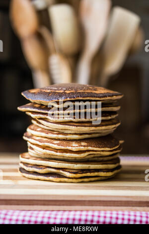 Stack of plain Pancakes on wooden surface Stock Photo - Alamy