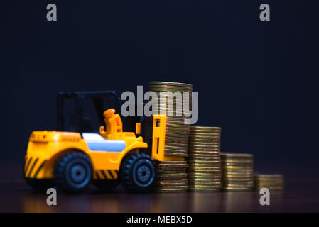 Mini forklift truck loading stack coin with steps of gold coin ...