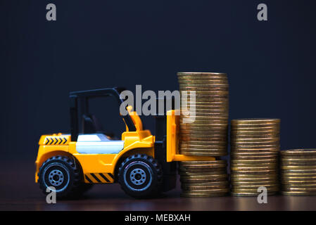 Mini forklift truck loading stack coin with steps of gold coin ...