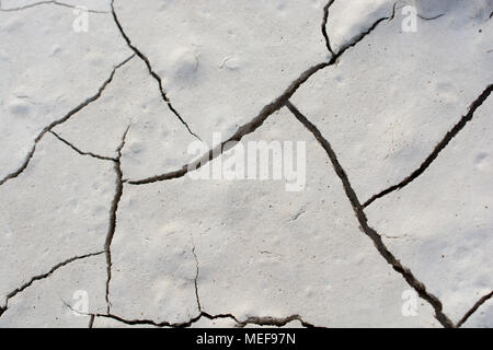 Grey color dry cracked muddy earth as a background texture Stock Photo ...