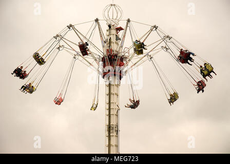 The Hanging Swing Seats of a High Fun Fair Ride Stock Photo - Alamy