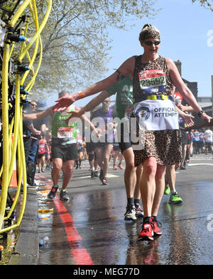 Runners use showers to cool off during the 2018 Virgin Money London ...