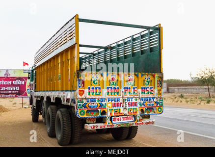 Driving in India: view of a typical brightly coloured back of an Indian ...