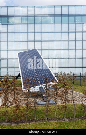 Blue rotating solar panels tilted axis tracker, future energy concept ...