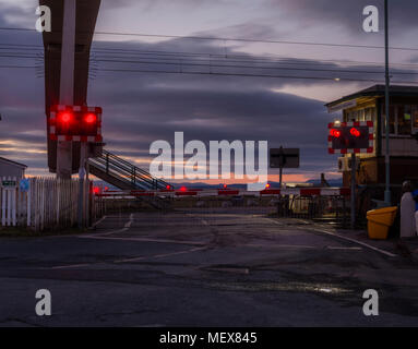 Hest Bank Level crossing with barriers and flashing lights on the west ...