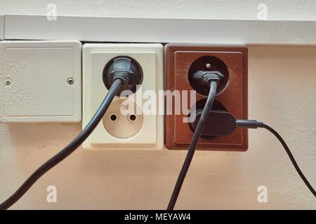 Electric sockets in the corner Stock Photo - Alamy