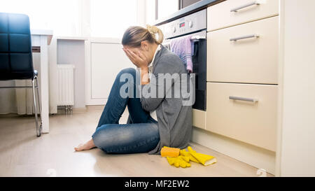 young girl crying at the kitchen table Stock Photo - Alamy