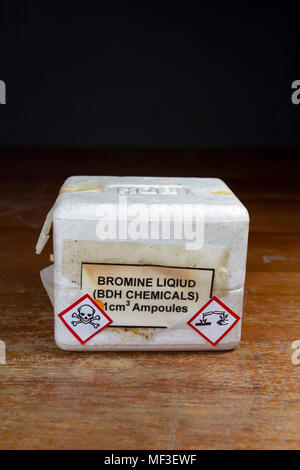 Ampoules (or vials) of liquid Bromine stored in a polystyrene container ...