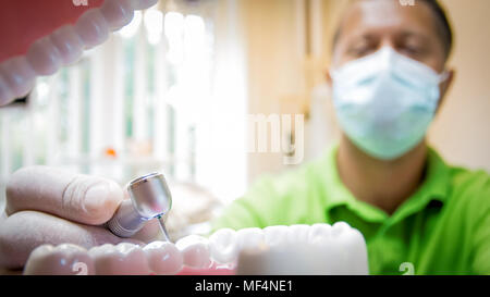 Closeup image of dentist removing teeth caries with dental drill Stock ...