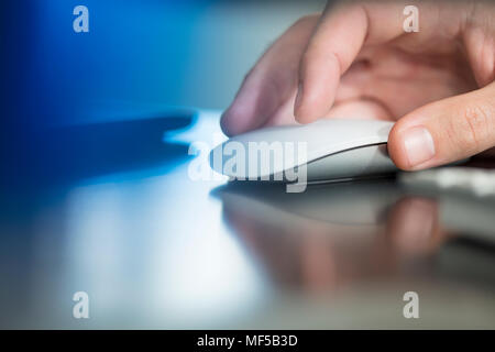 Man's hand using computer mouse Stock Photo - Alamy