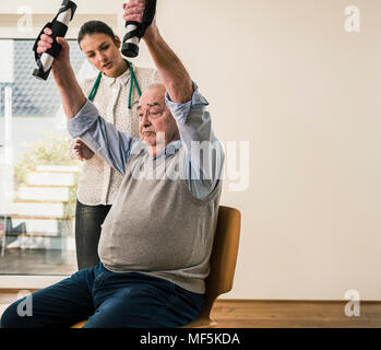 Young caucasian physiotherapist woman holding yoga mat doing ok sign ...