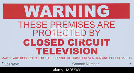 Warning Be Aware CCTV surveillance camera warning sign Stock Photo - Alamy