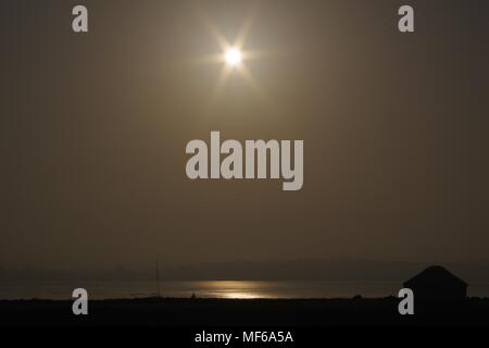 Silhouetted Yurt by a Misty Exe Estuary with a Starburst Sun. Turf Lock ...