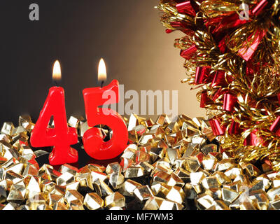 Birthday celebration number 45 candle with gold and silver balloons ...