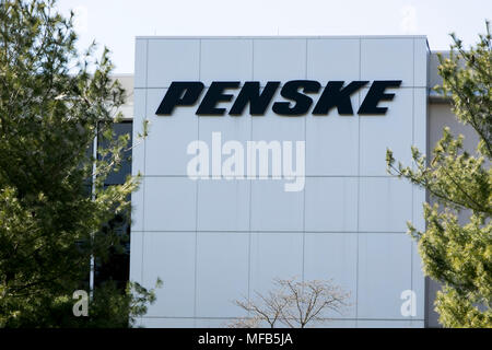 A logo sign outside of the headquarters of Penske Truck Leasing in ...