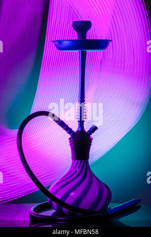 Blue eastern hookah on colorful background Stock Photo - Alamy